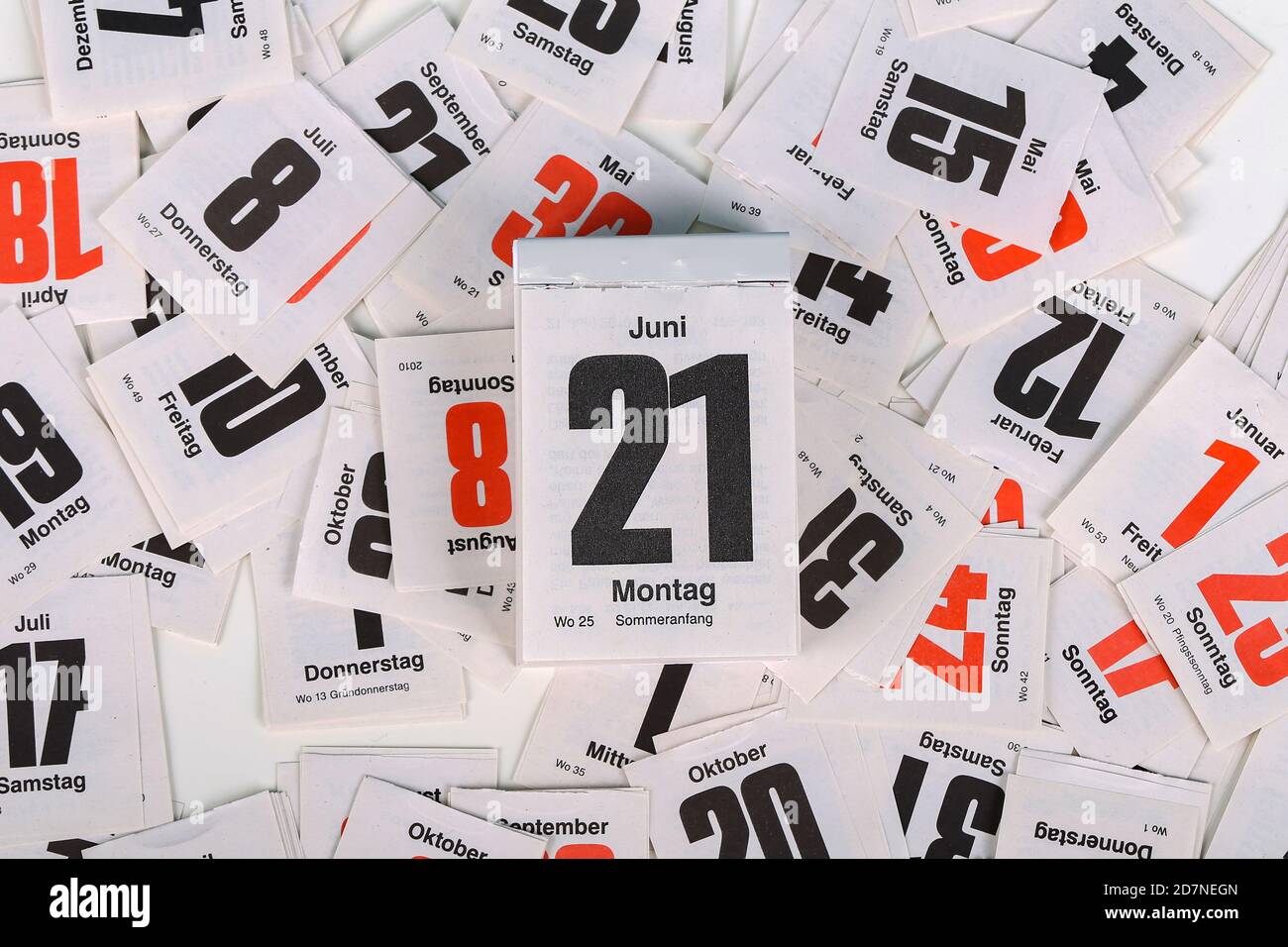 Calendar sheets scattered across the table with June 21 - the beginning ...