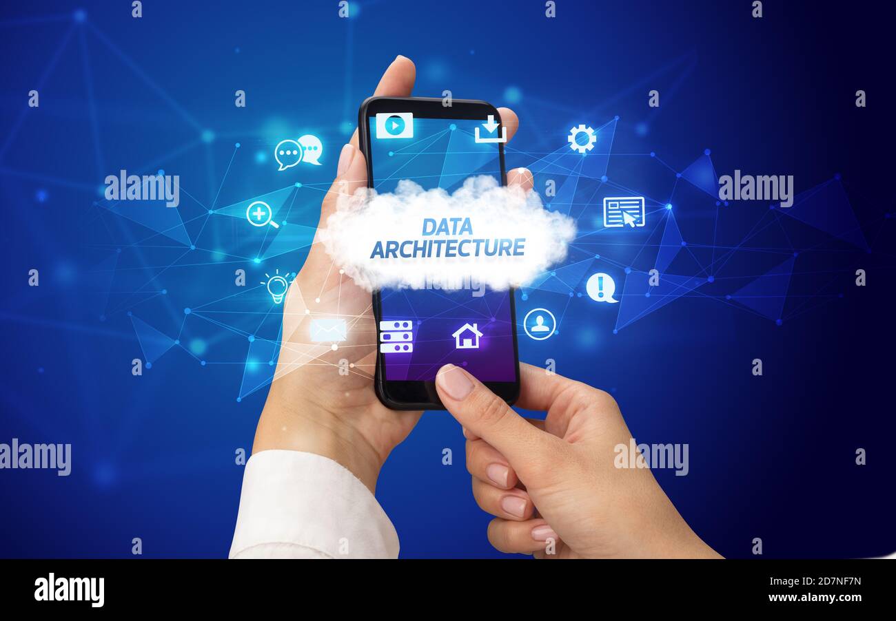 Female hand holding smartphone with DATA ARCHITECTURE inscription ...