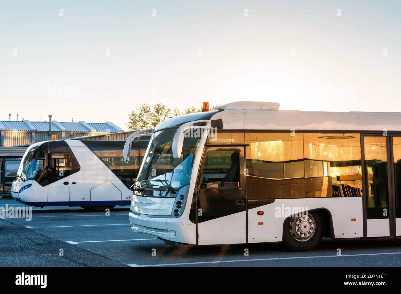 Shuttle buses at the parking lot of the airport Stock Photo - Alamy