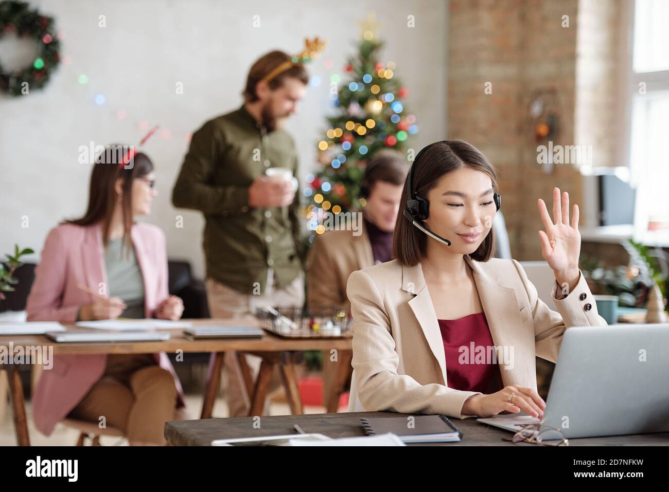 Young smiling female customer support representative with headset ...