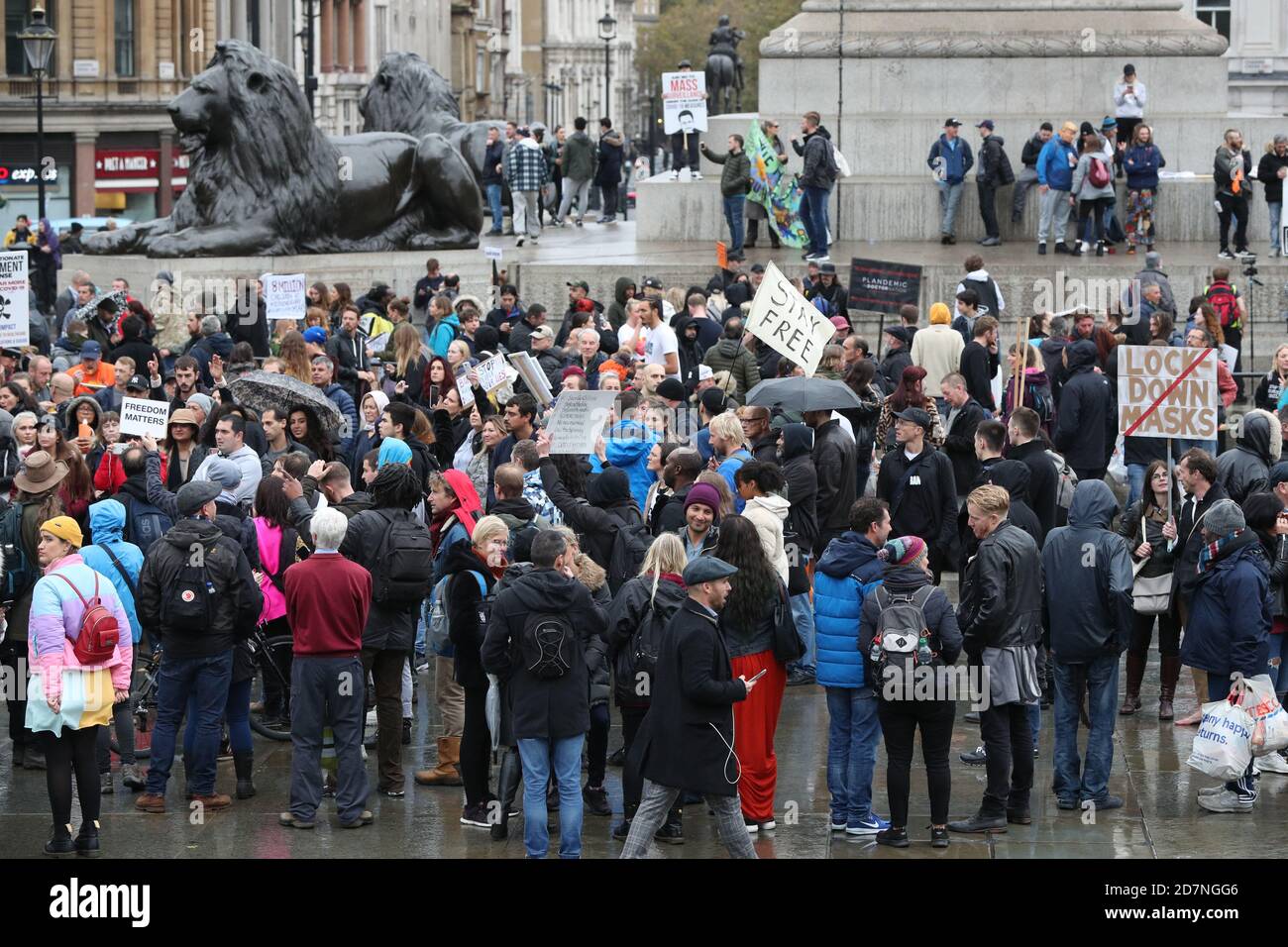 People pass through Trafalgar Square, London, protesting against the ...