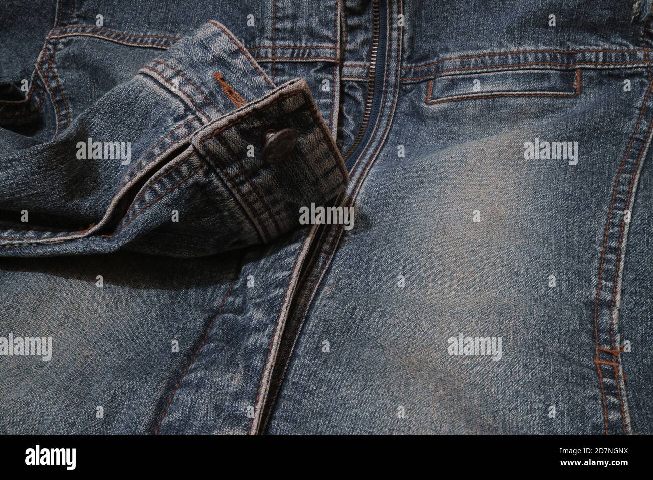 Textured background of blue denim jeans with seam and thread stitch ...