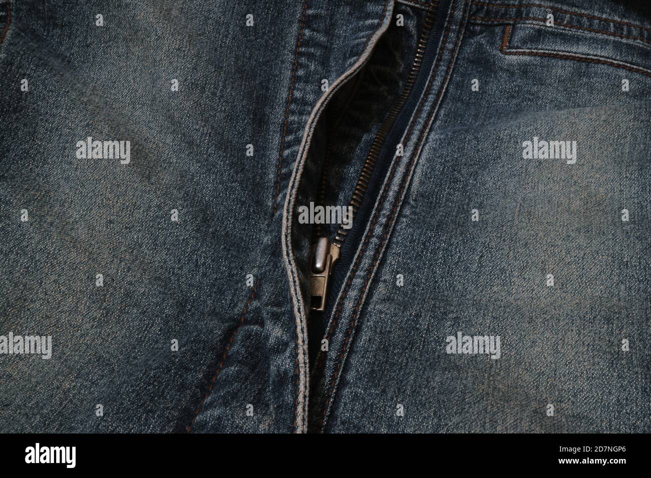 Textured background of blue denim jeans with seam and thread stitch ...