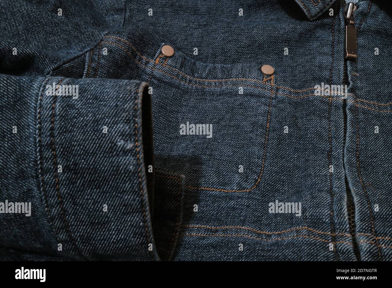 Textured background of blue denim jeans with seam and thread stitch ...
