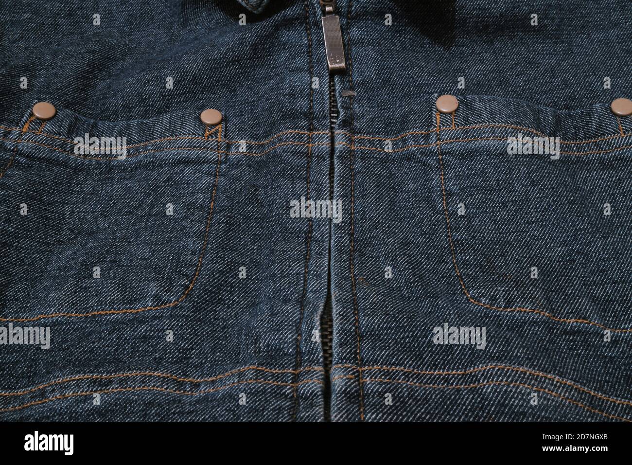 Textured background of blue denim jeans with seam and thread stitch ...