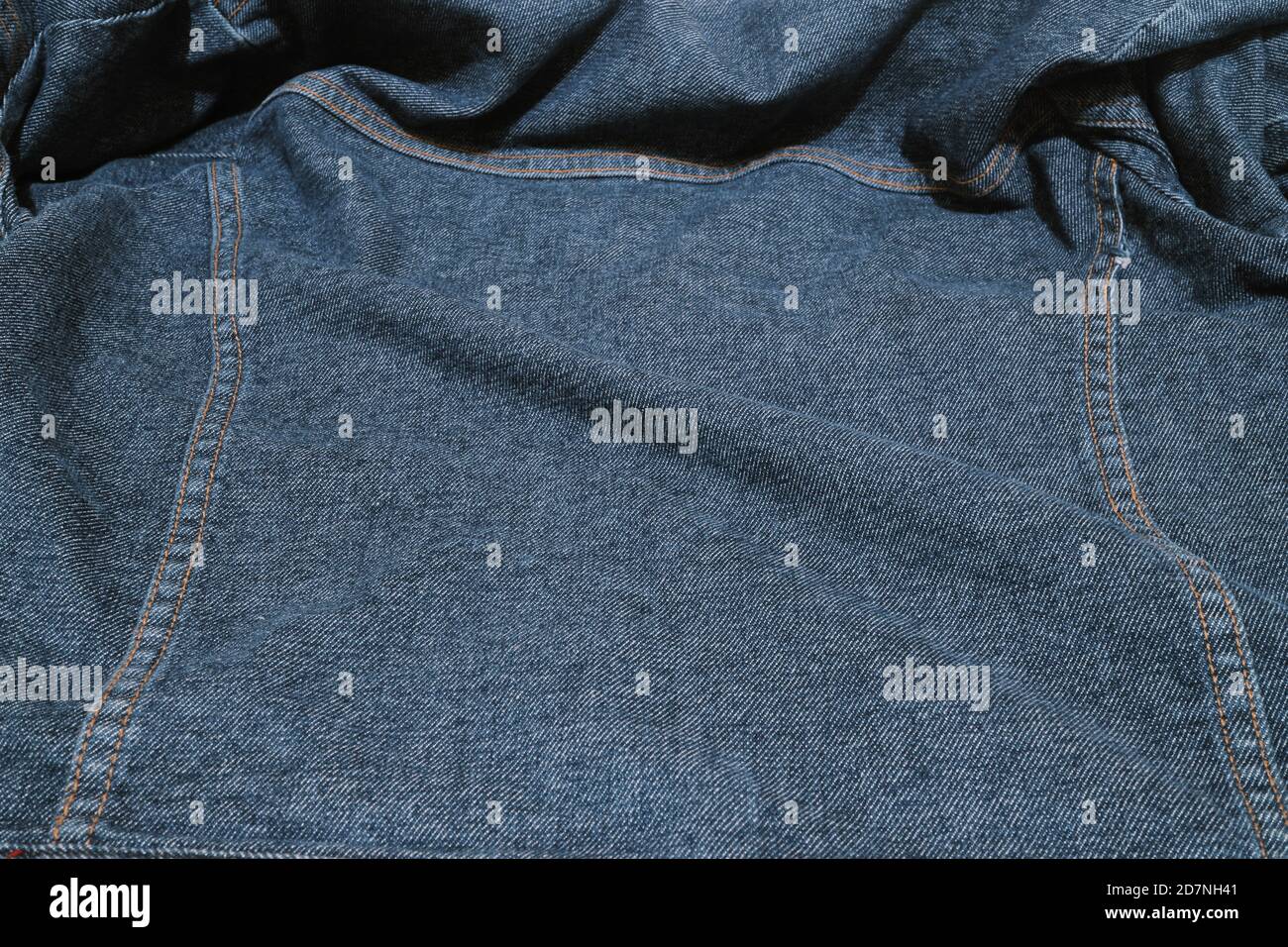 Textured background of blue denim jeans with seam and thread stitch ...