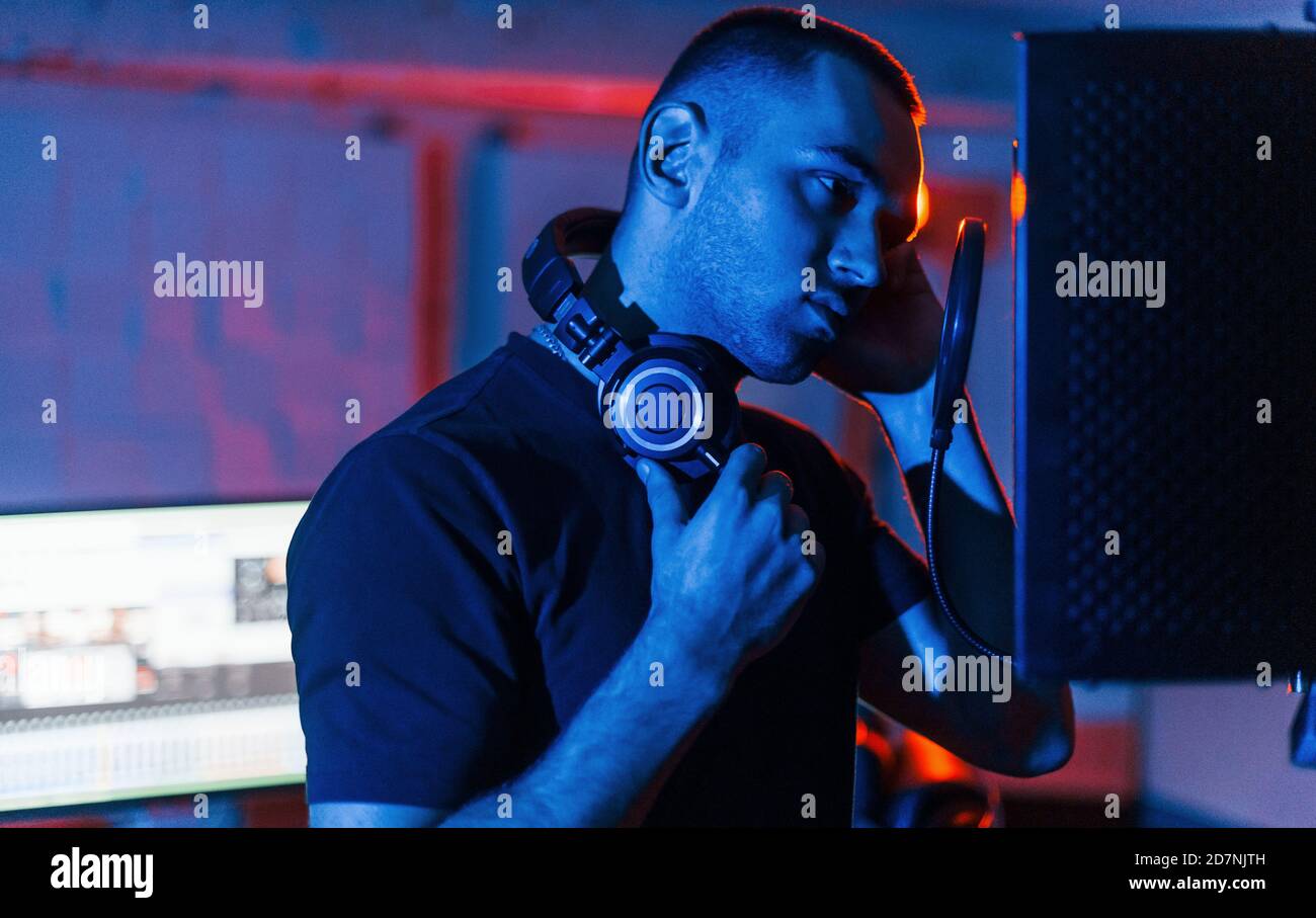 Vocalist have recording session indoors in the modern professional ...