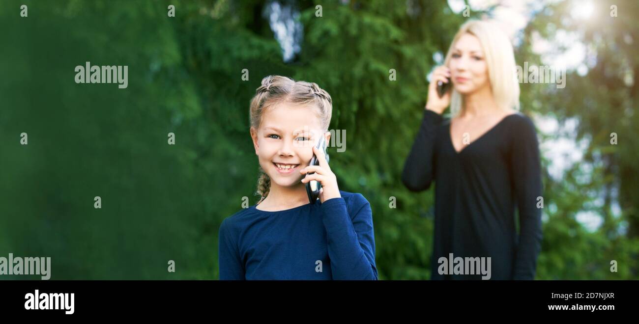 Mom and daughter. Phone conversation. Happy family portrait Stock Photo ...
