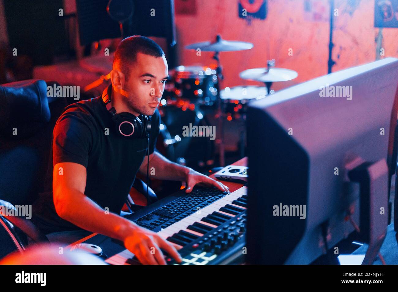 Sound engineer working and mixing music indoors in the studio Stock ...