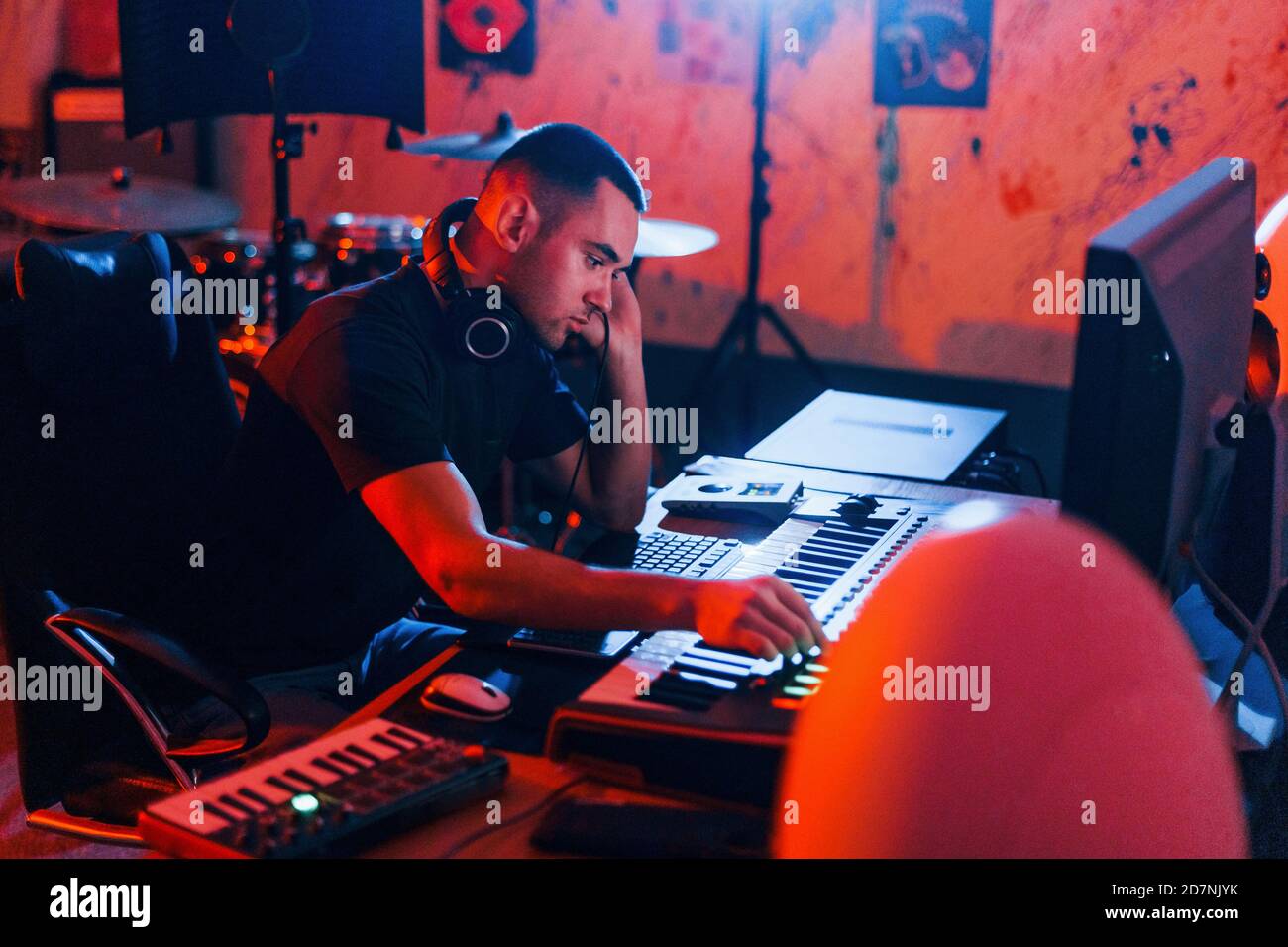Sound engineer working and mixing music indoors in the studio Stock ...