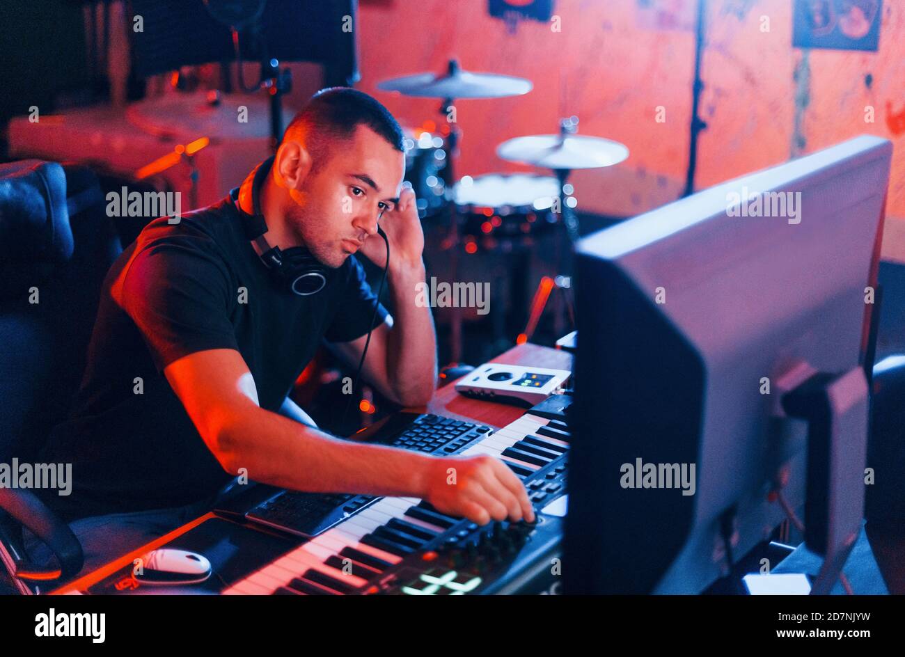 Sound engineer working and mixing music indoors in the studio Stock ...