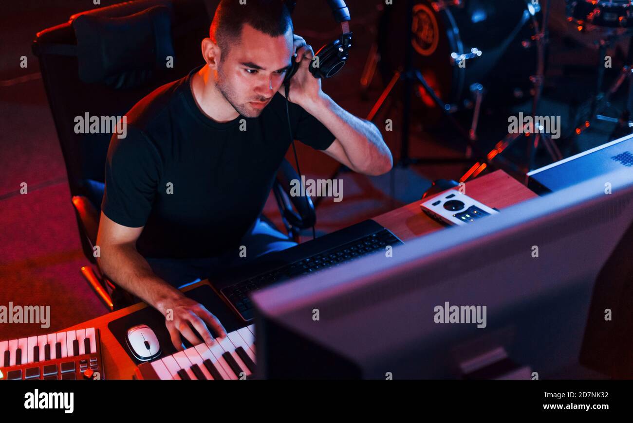 Sound engineer working and mixing music indoors in the studio Stock ...