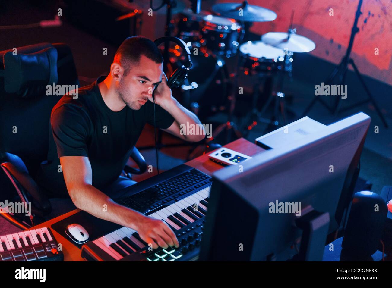 Sound engineer working and mixing music indoors in the studio Stock ...