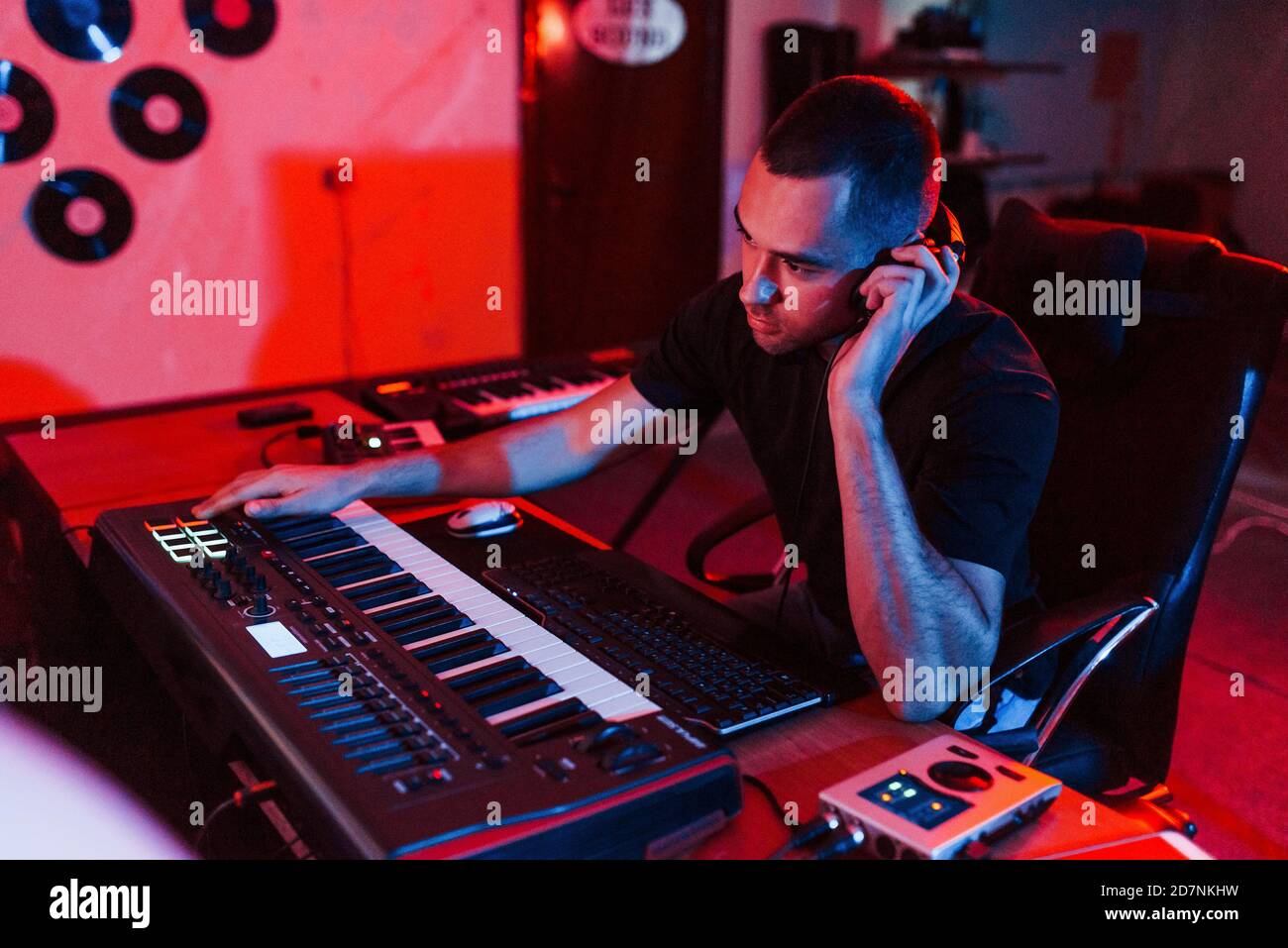 Professional sound engineer working and mixing music indoors in the ...