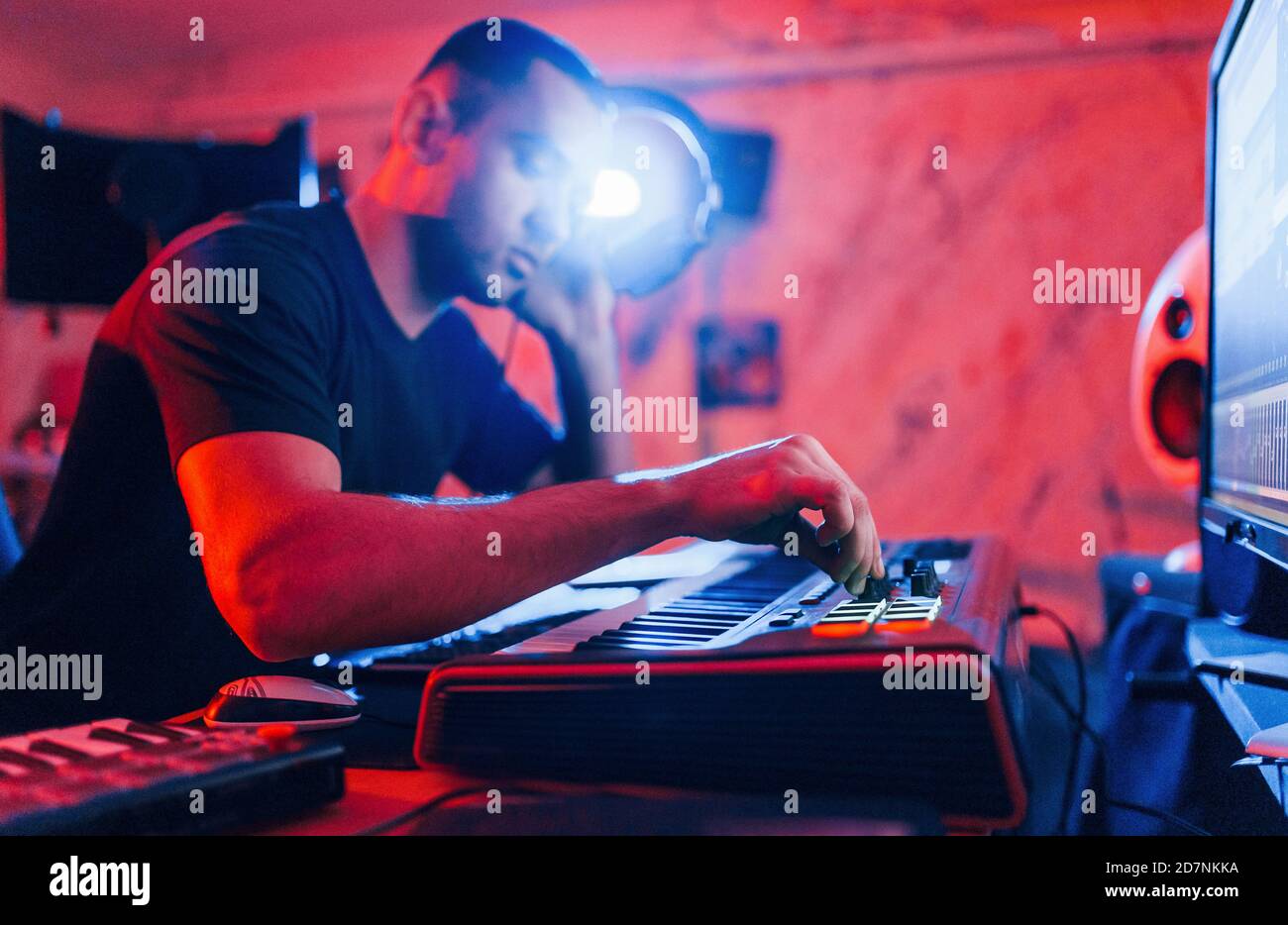 Professional sound engineer working and mixing music indoors in the ...