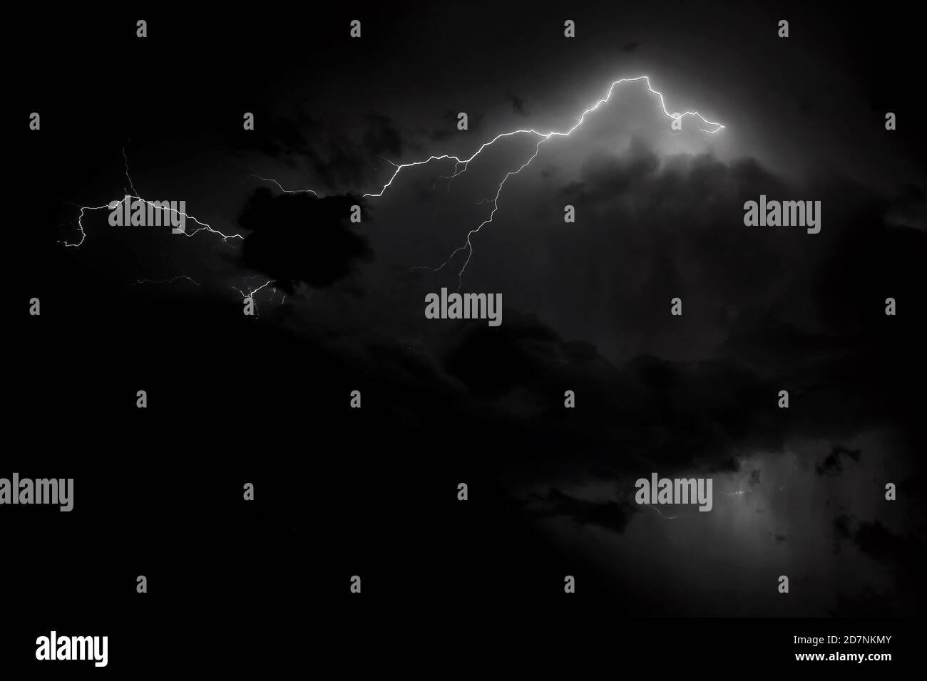 lightning flash in sky at night with heavy clouds Stock Photo - Alamy