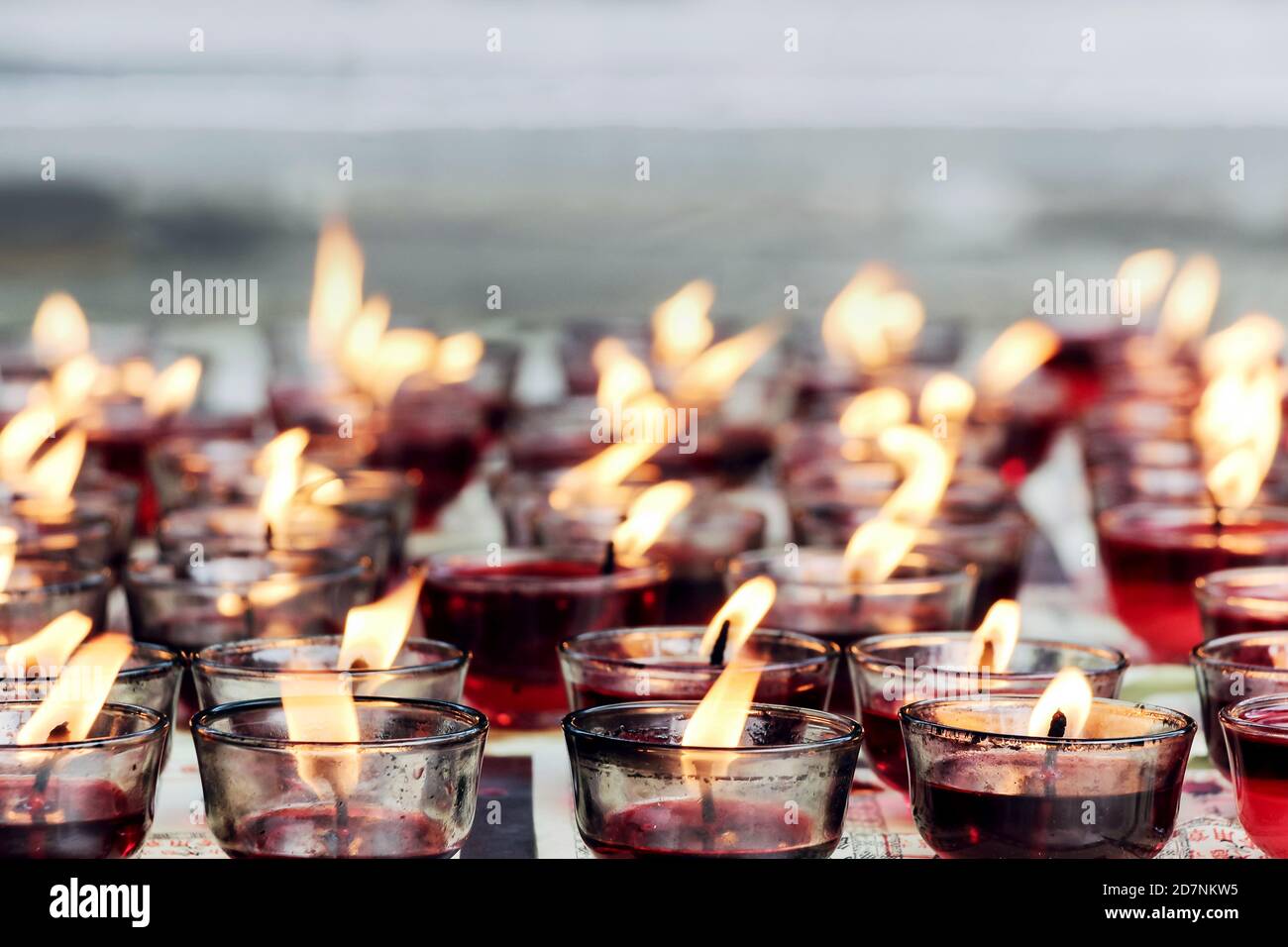 burning oil candles in a row at chinese temple Stock Photo - Alamy