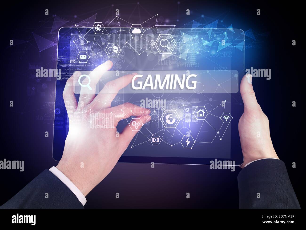 Close-up of a tablet searching GAMING inscription, hi-tech computing ...