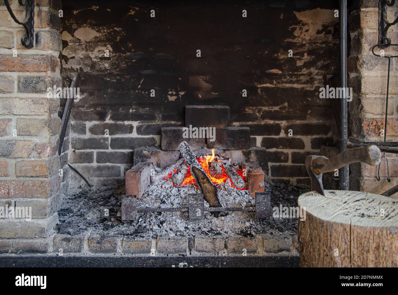 Large Fireplace with a burning fire and decorative items, comfort and ...