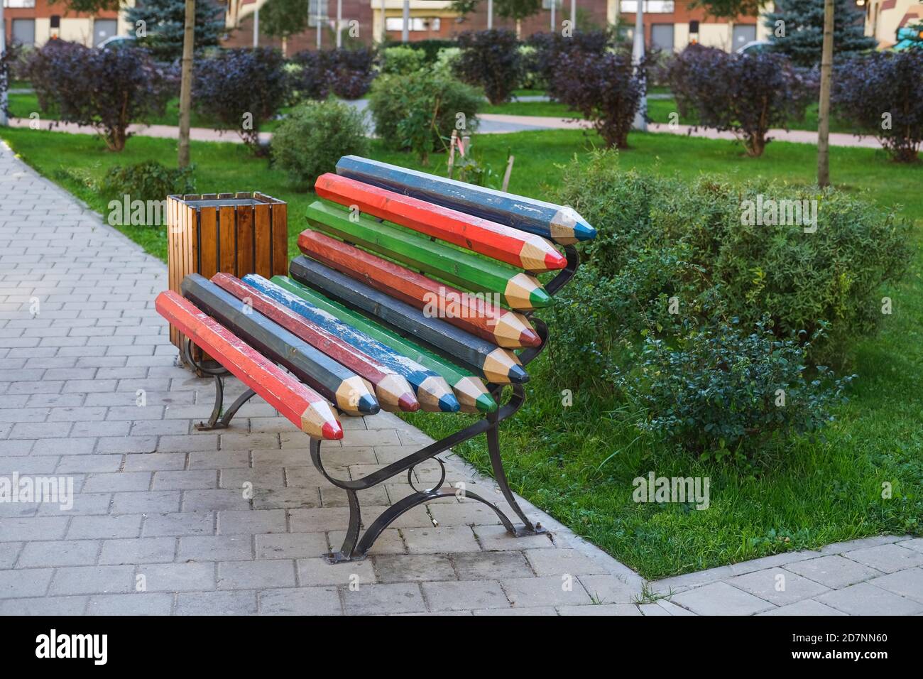 Creative multi colored wooden bench made of boards stylized as colour ...