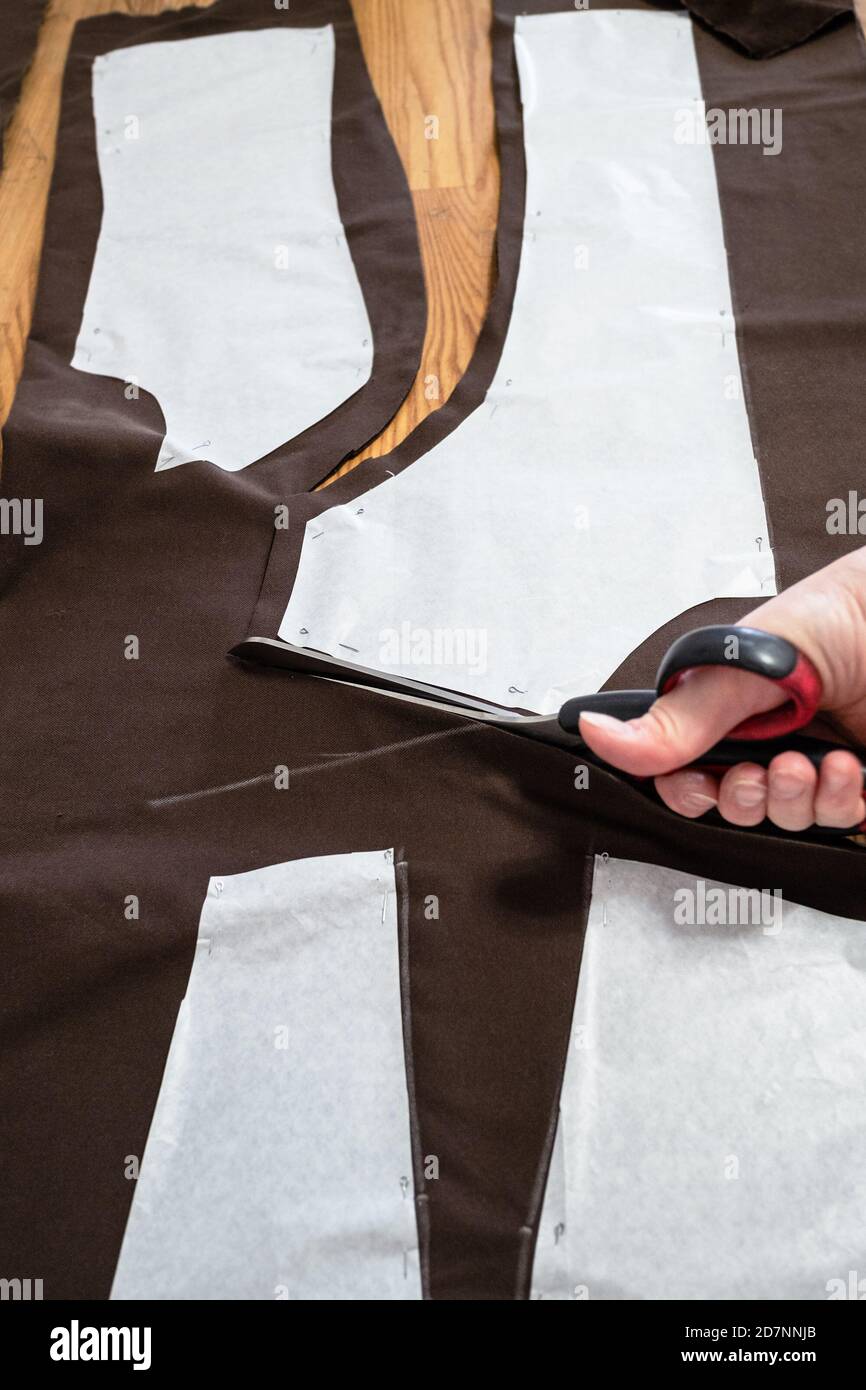 Hand dress making scissors cutting hi-res stock photography and images ...