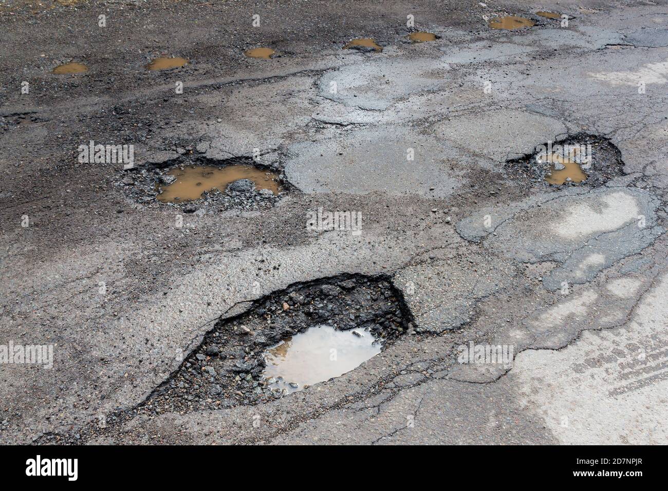 Pothole and puddle in road hi-res stock photography and images - Alamy