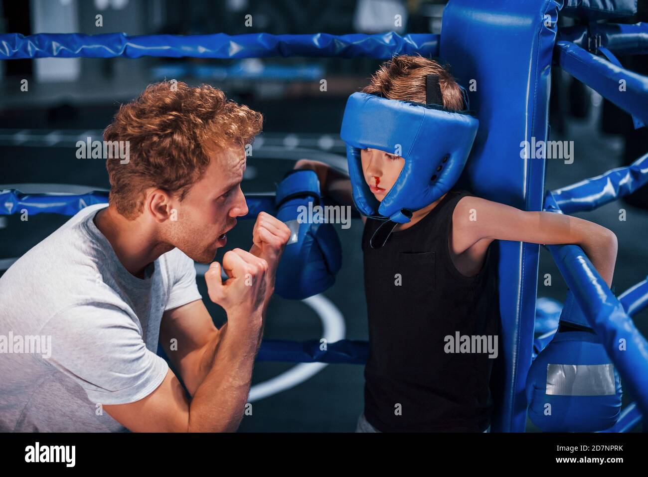Trainer helping boxer hi-res stock photography and images - Alamy