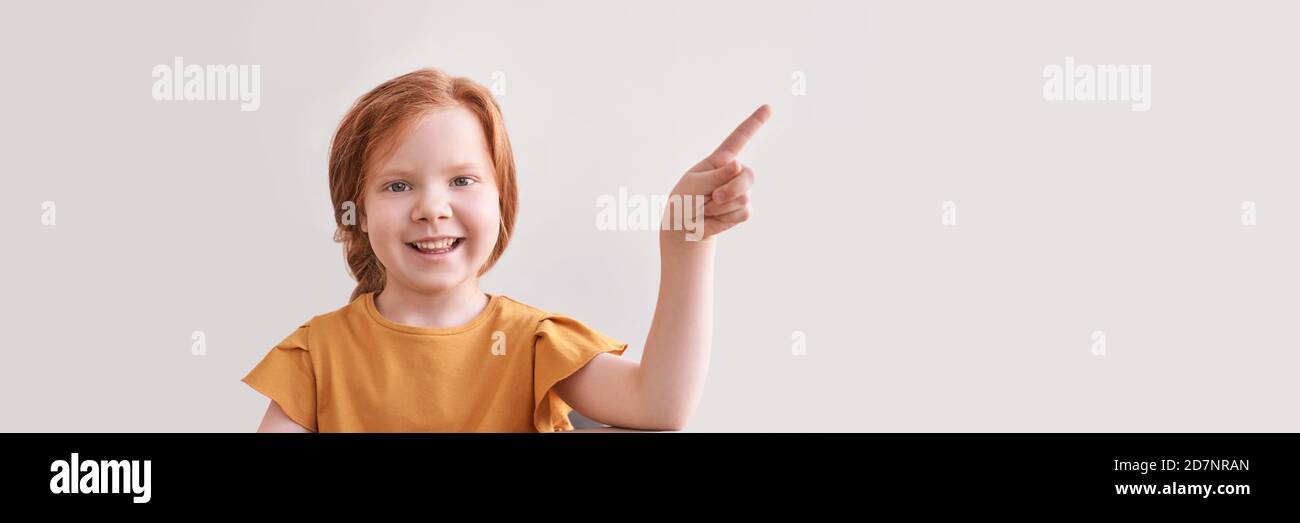 Pretty young student pointing. Elementary school children Stock Photo ...