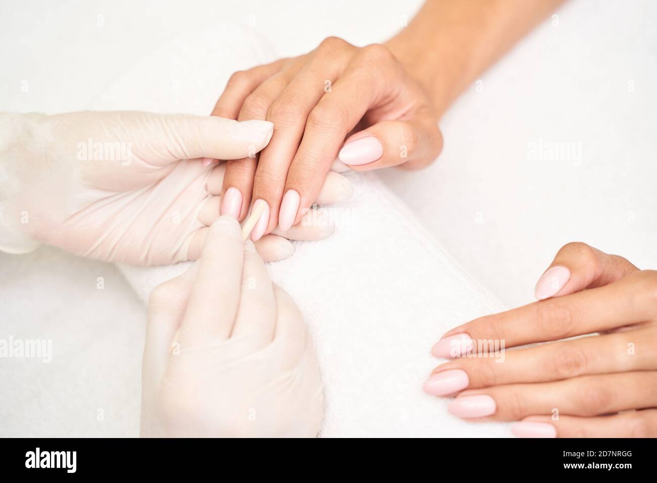 Classic pink wedding nail manicure on white backdrop. Spa treatment ...