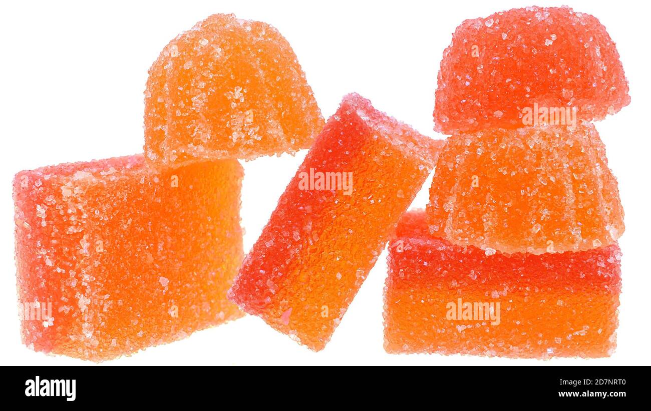 Handful of red and orange candy close up on a white background Stock ...