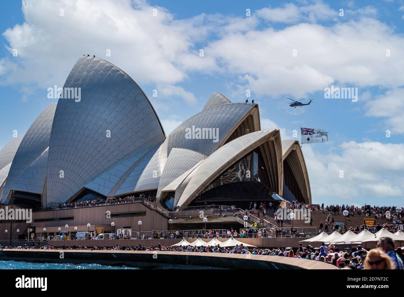Helicopter flying Australian flag flying close to the Sydney Opera ...