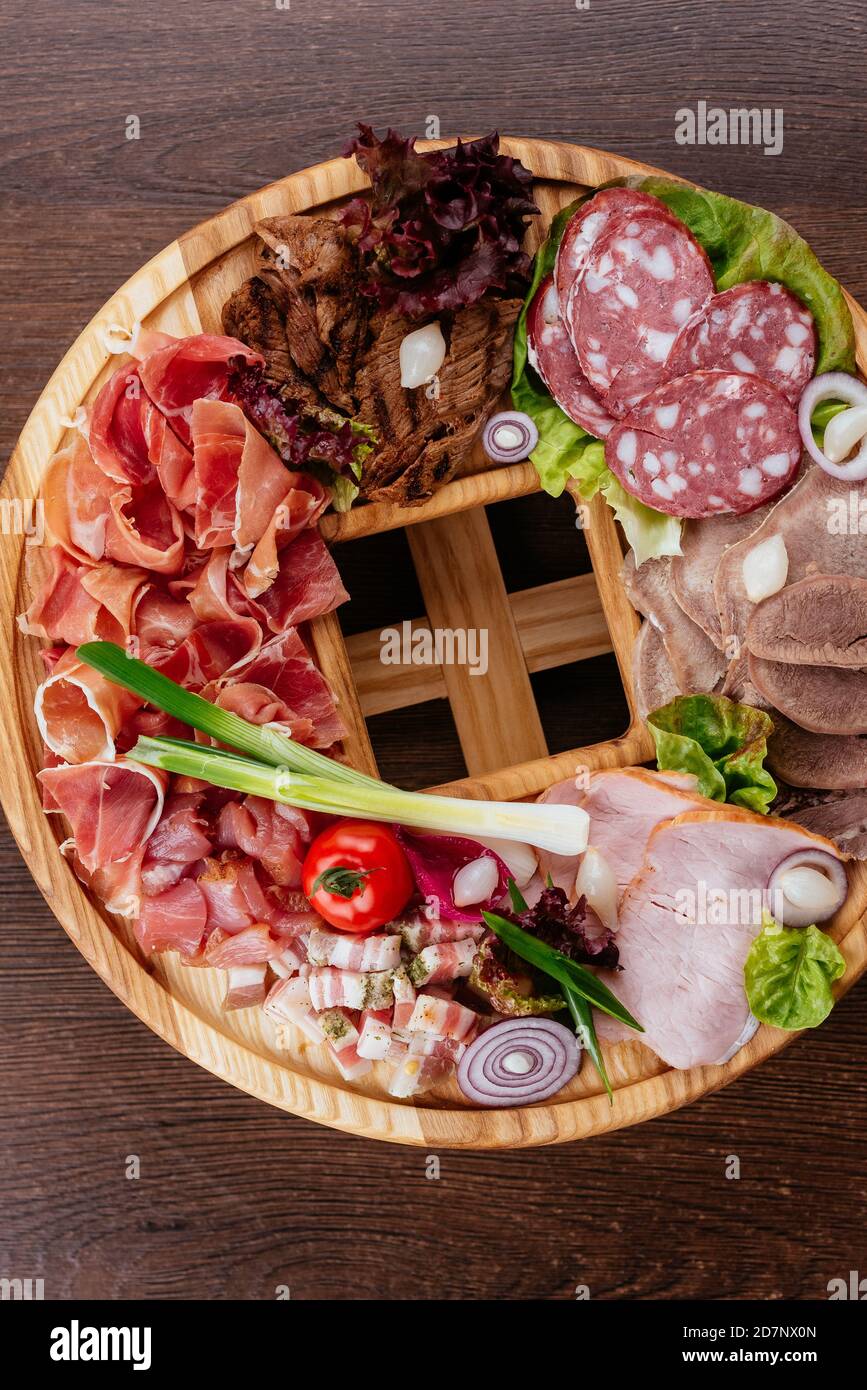 large wooden plate with cold cuts Stock Photo - Alamy