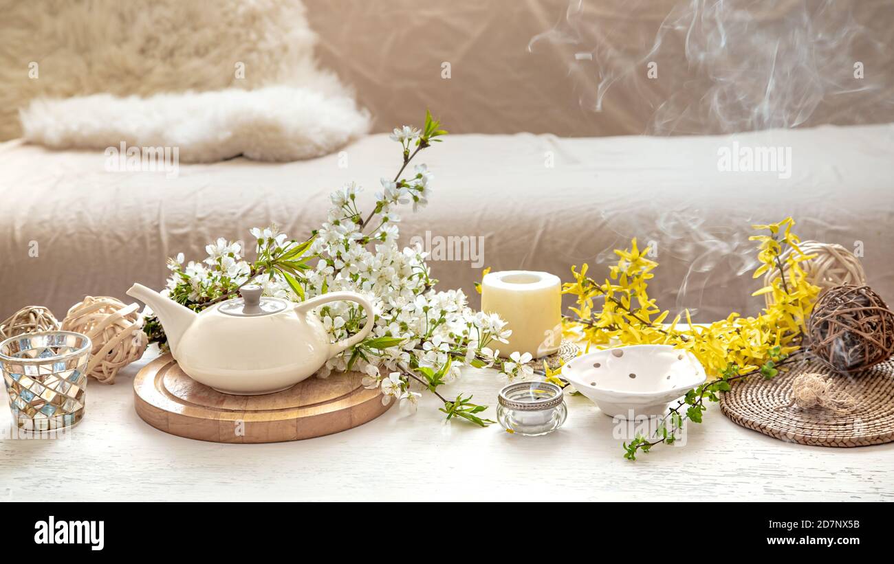 Composition with spring flowers in a cozy living room interior . The ...