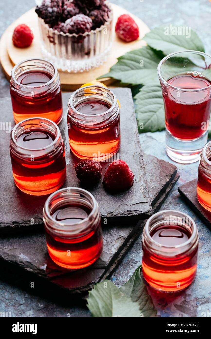 red alcoholic shots with various bartender's paraphernalia Stock Photo ...