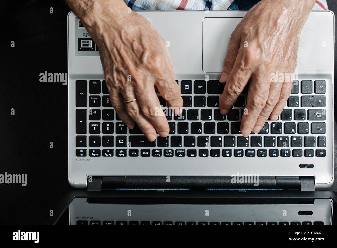 elderly person working on laptop Stock Photo - Alamy