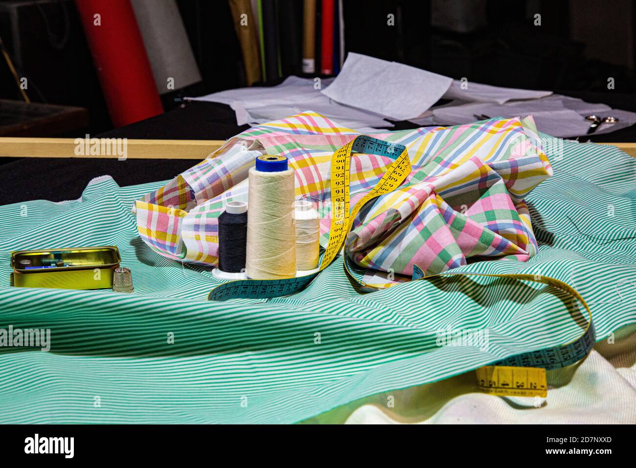 Detail of sewing table with fabrics, meter and sewing thread Stock ...