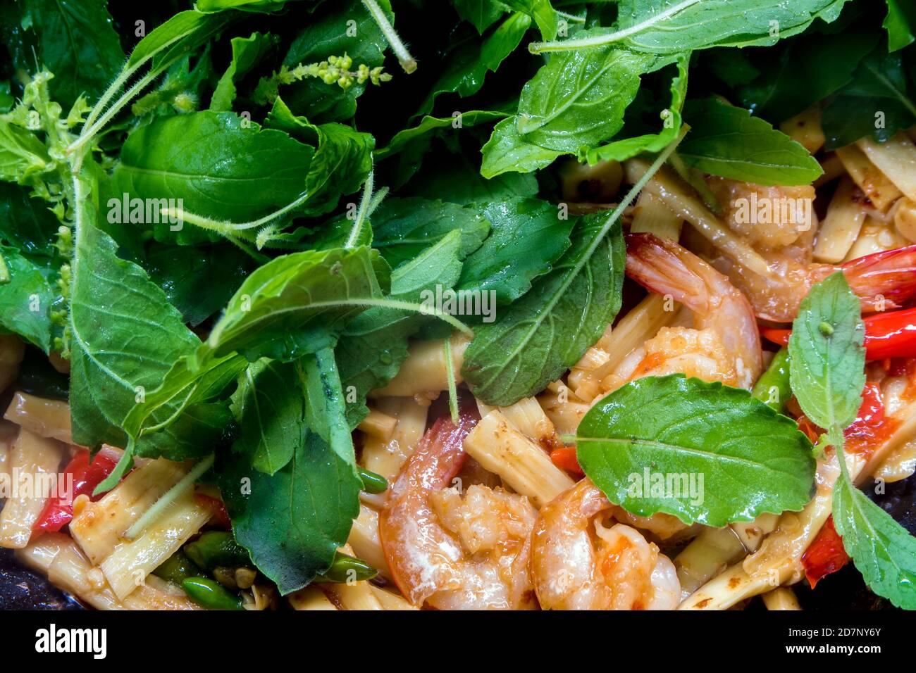 Shrimp, Garlic, Chilli , Bamboo shoot and basil fried in a saucepan ...