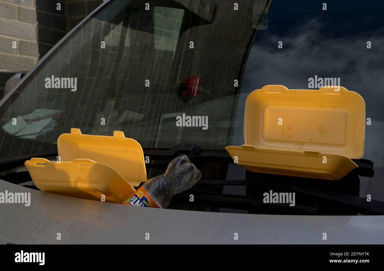 Empty,polystyrene food containers in the winscreen of a car in Cardiff ...