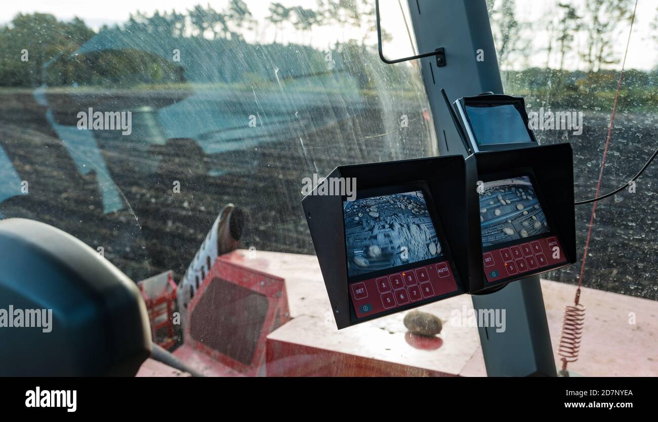 Inside cabin of Grimme potato harvester with monitors, Luffness Mains ...