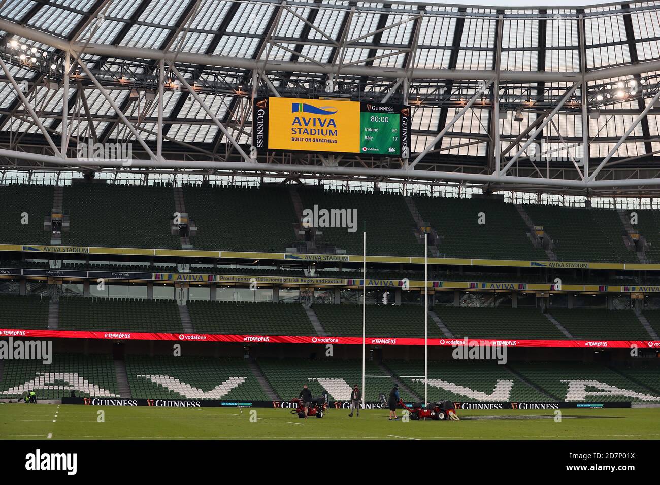 The scoreboard shows the 50-17 final score as ground staff tend to the ...