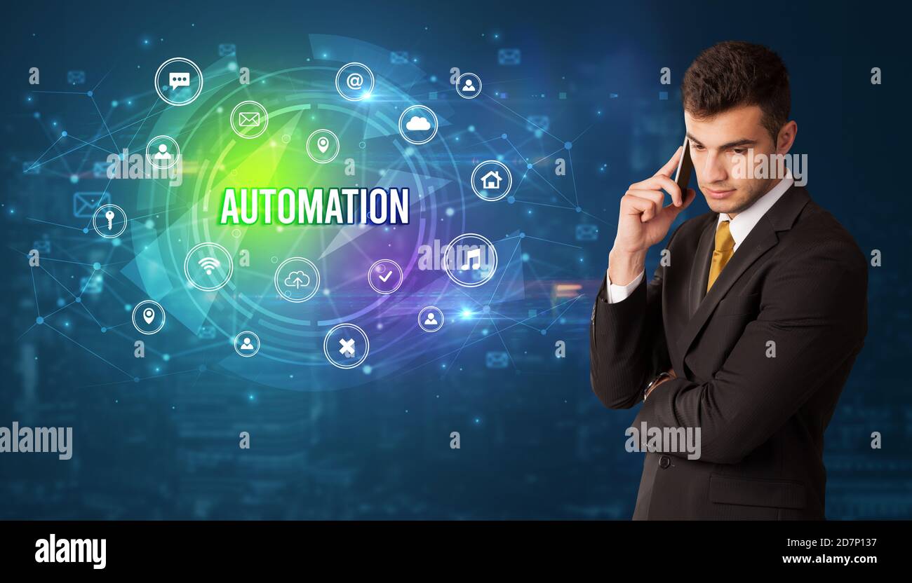 Businessman thinking in front of technology related icons and ...
