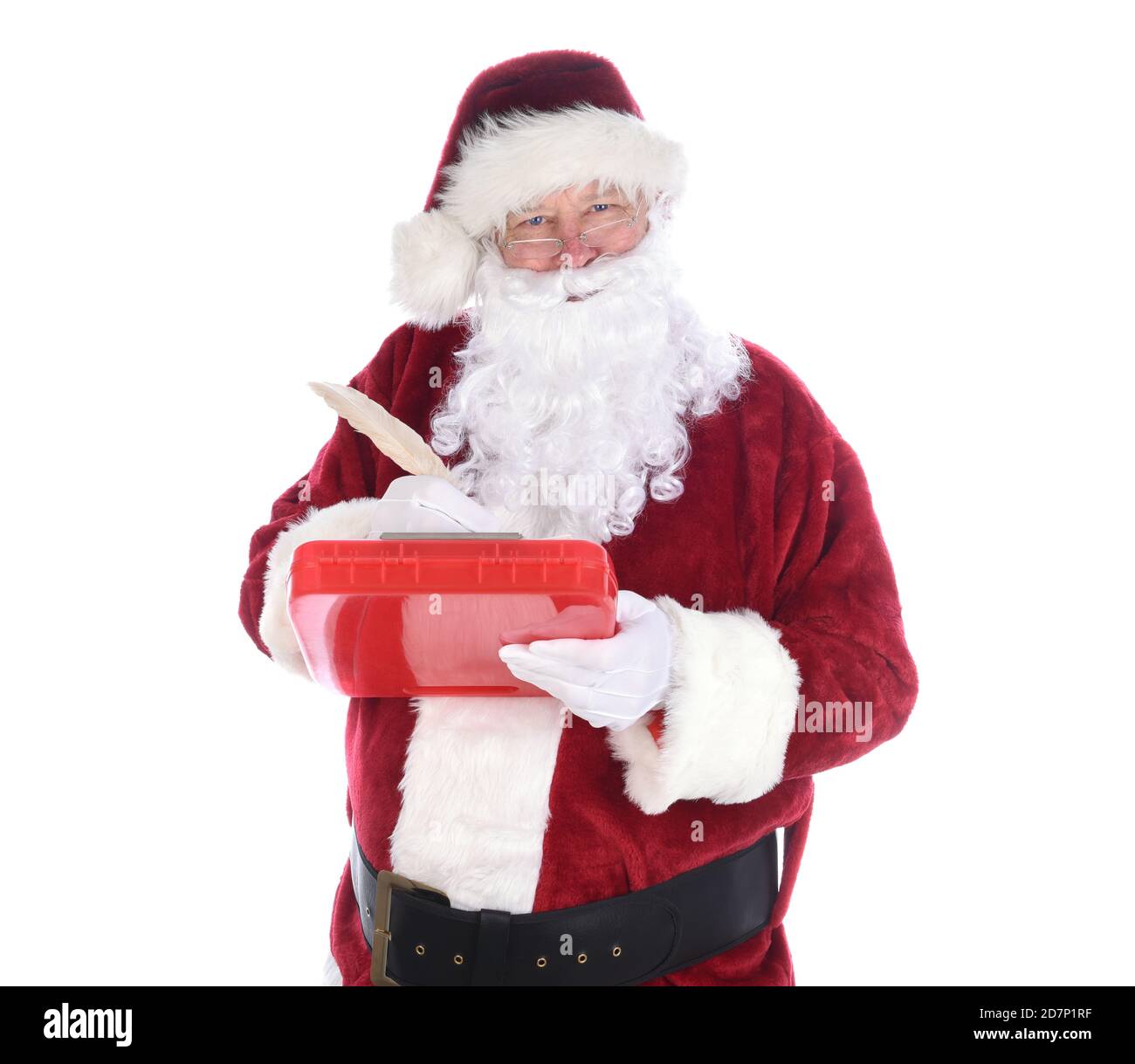 Santa Claus holding a clipboard holding aqill pen making notes on his ...