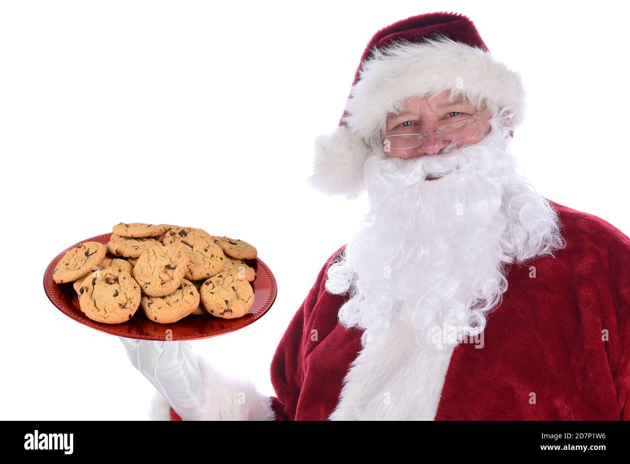 Santa Claus holding a large red platter full of fresh baked chocolate ...