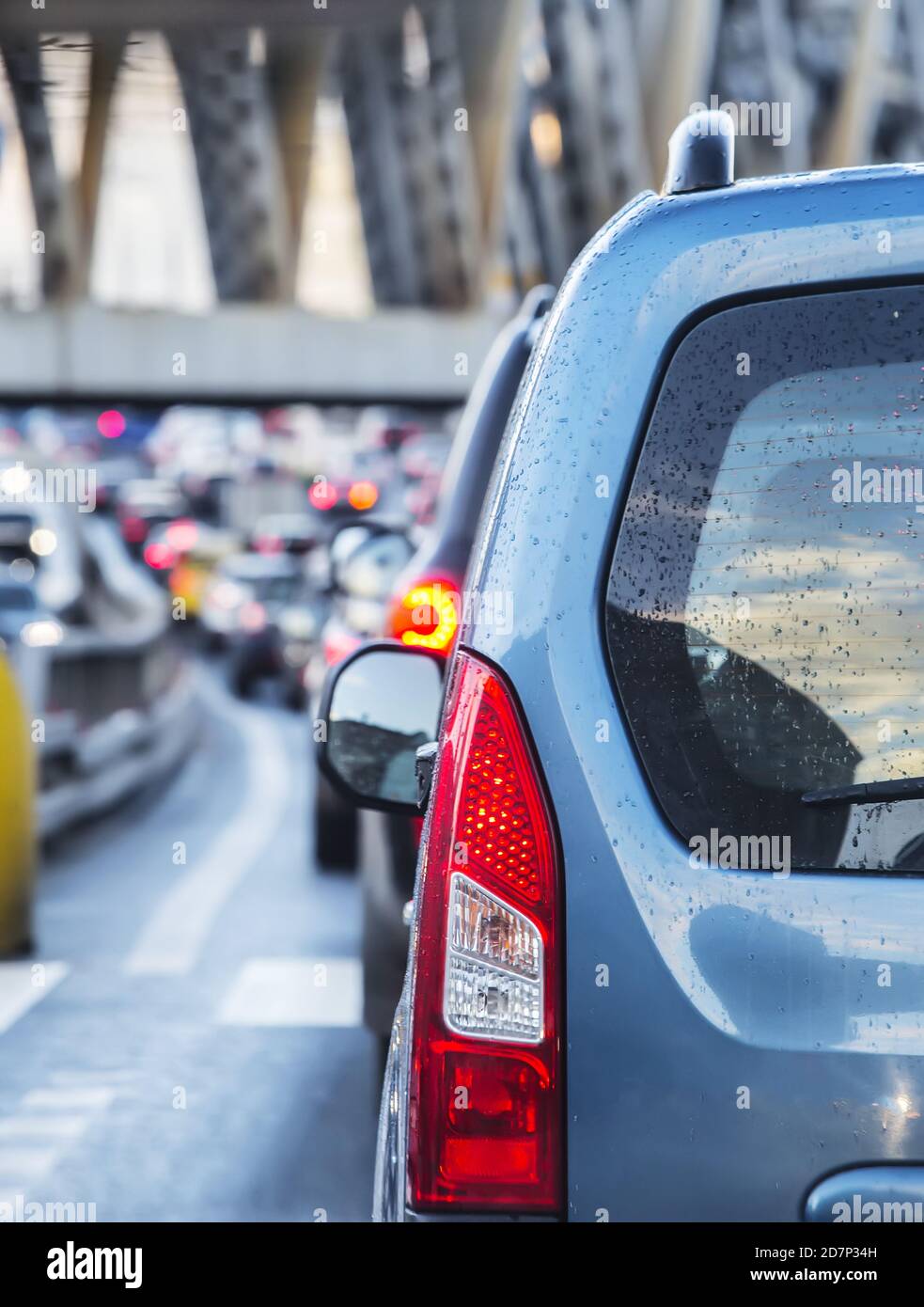 A car in a big traffic jam. Back view. Blurred background Stock Photo ...