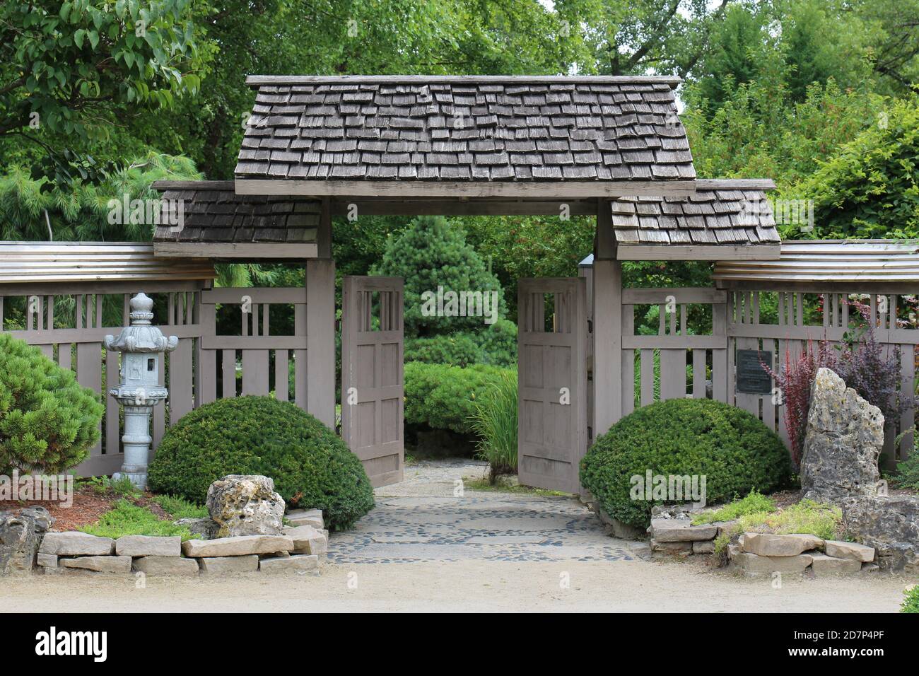 A wood privacy fence and arbor opening into a Japanese Garden at Rotary ...