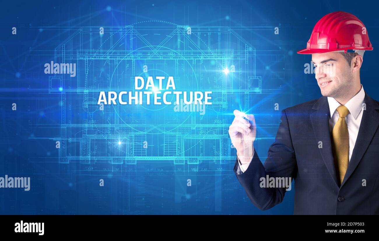 Handsome architect with helmet drawing DATA ARCHITECTURE inscription ...