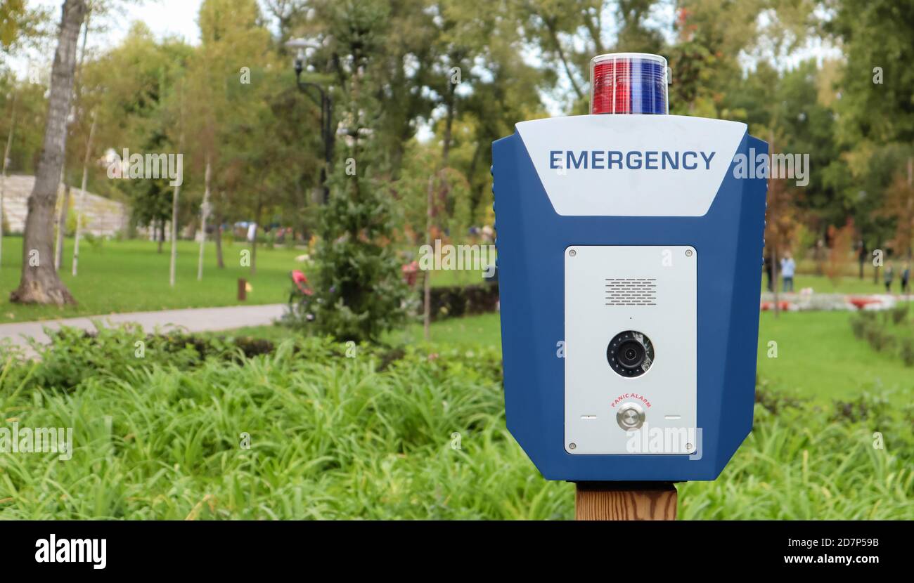 Emergency button in a public city park with an English word emergency ...