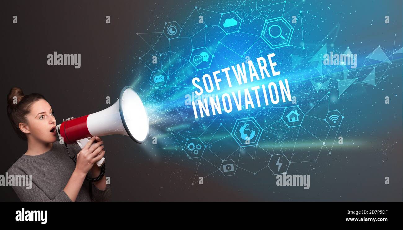 Young woman shouting in megaphone with SOFTWARE INNOVATION inscription ...