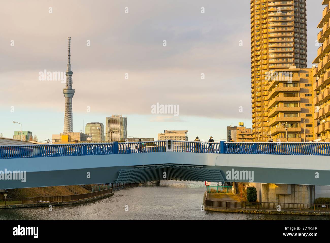 People walk on the Onagigawa Clover Bridge at Koto Ward Tokyo Japan ...