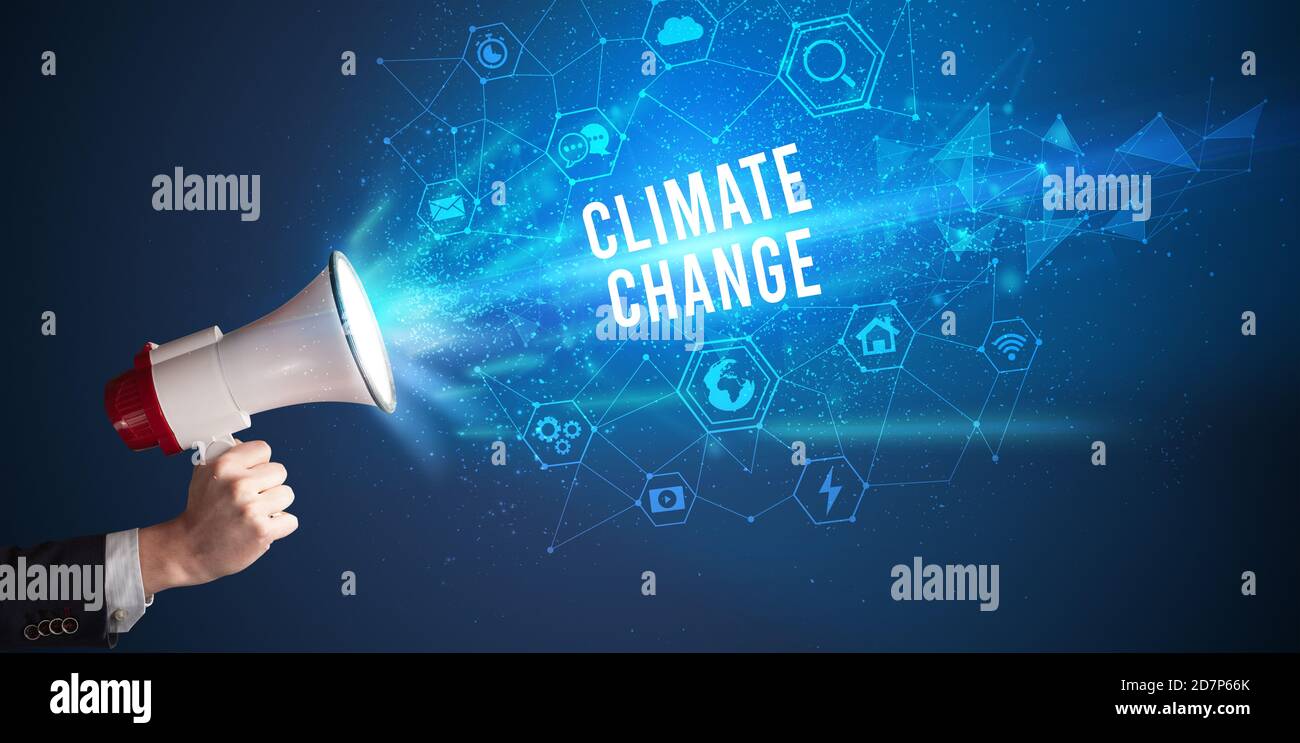 Young woman shouting in megaphone with CLIMATE CHANGE inscription ...